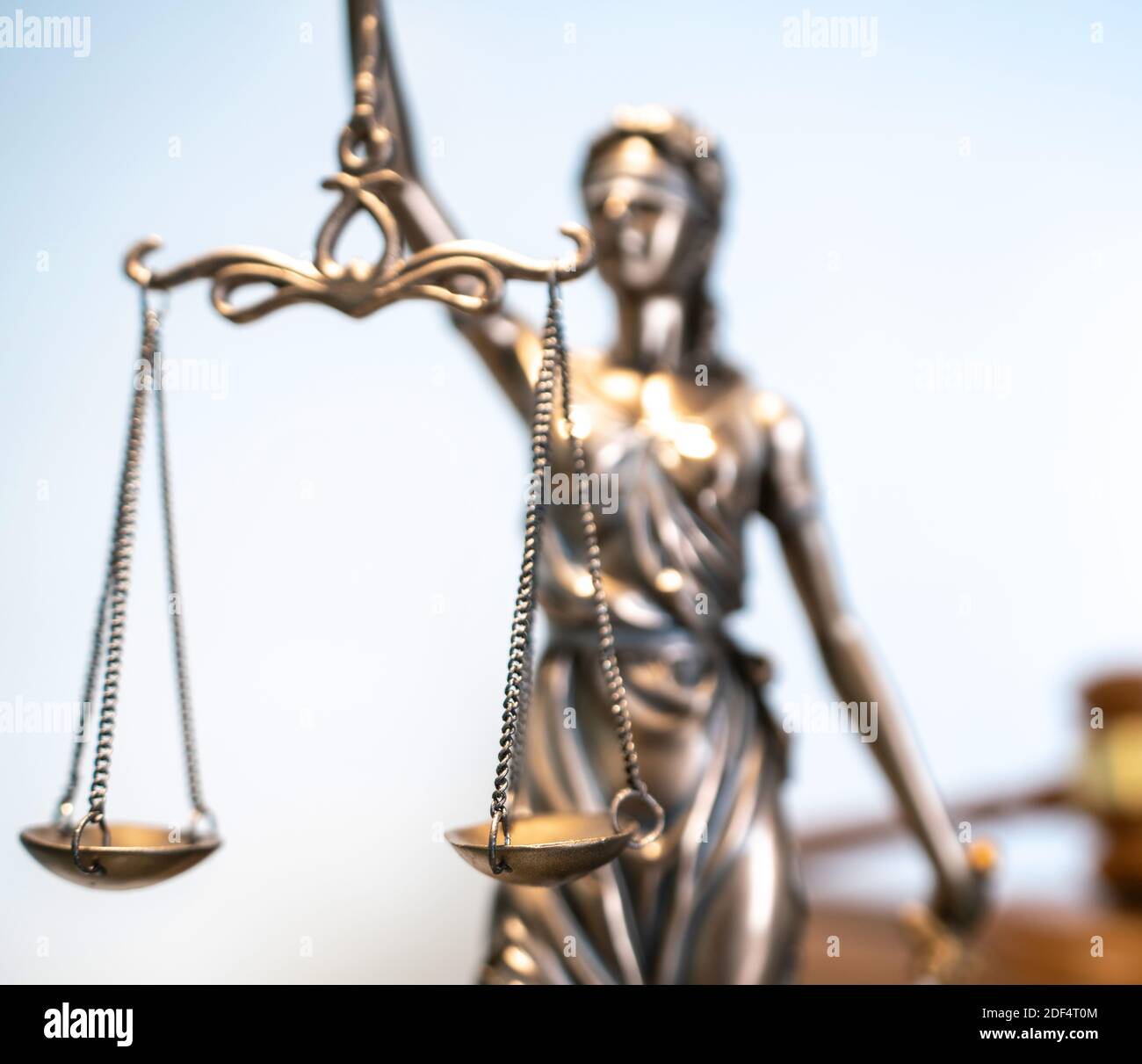 Statue of lady justice on bright background - Side view with copy space ...