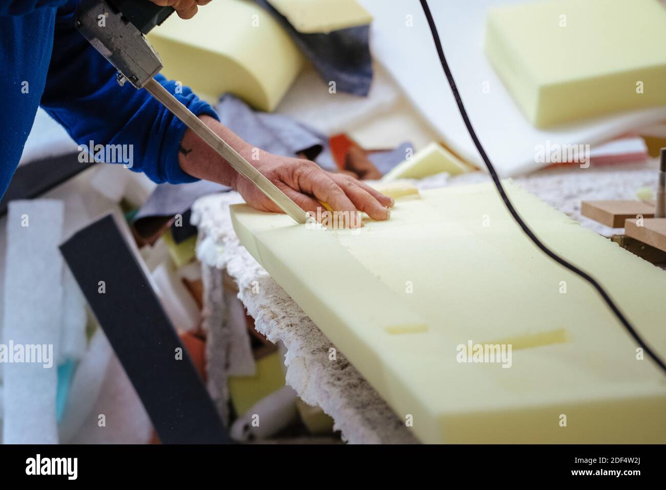 A closeup shot of a male working in a furniture factory Stock Photo - Alamy