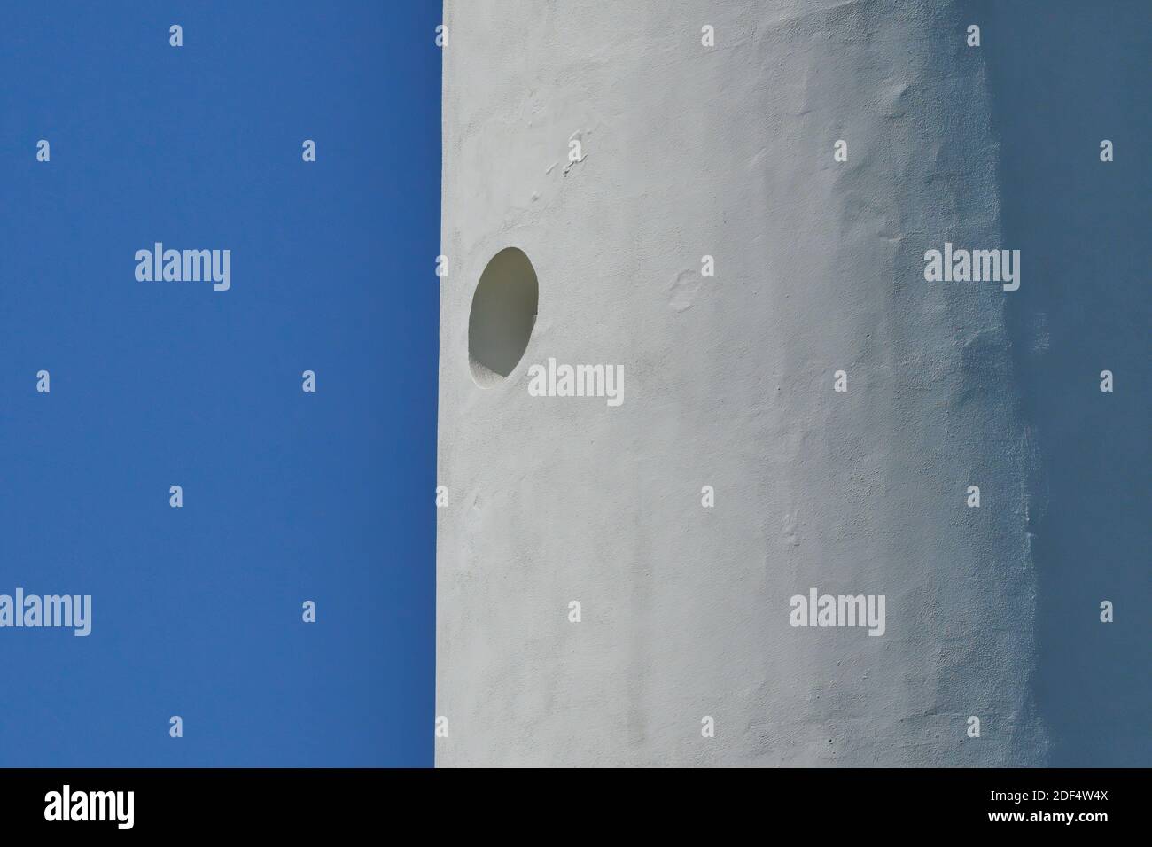 Detail of a white lighthouse. Dark blue background Stock Photo - Alamy