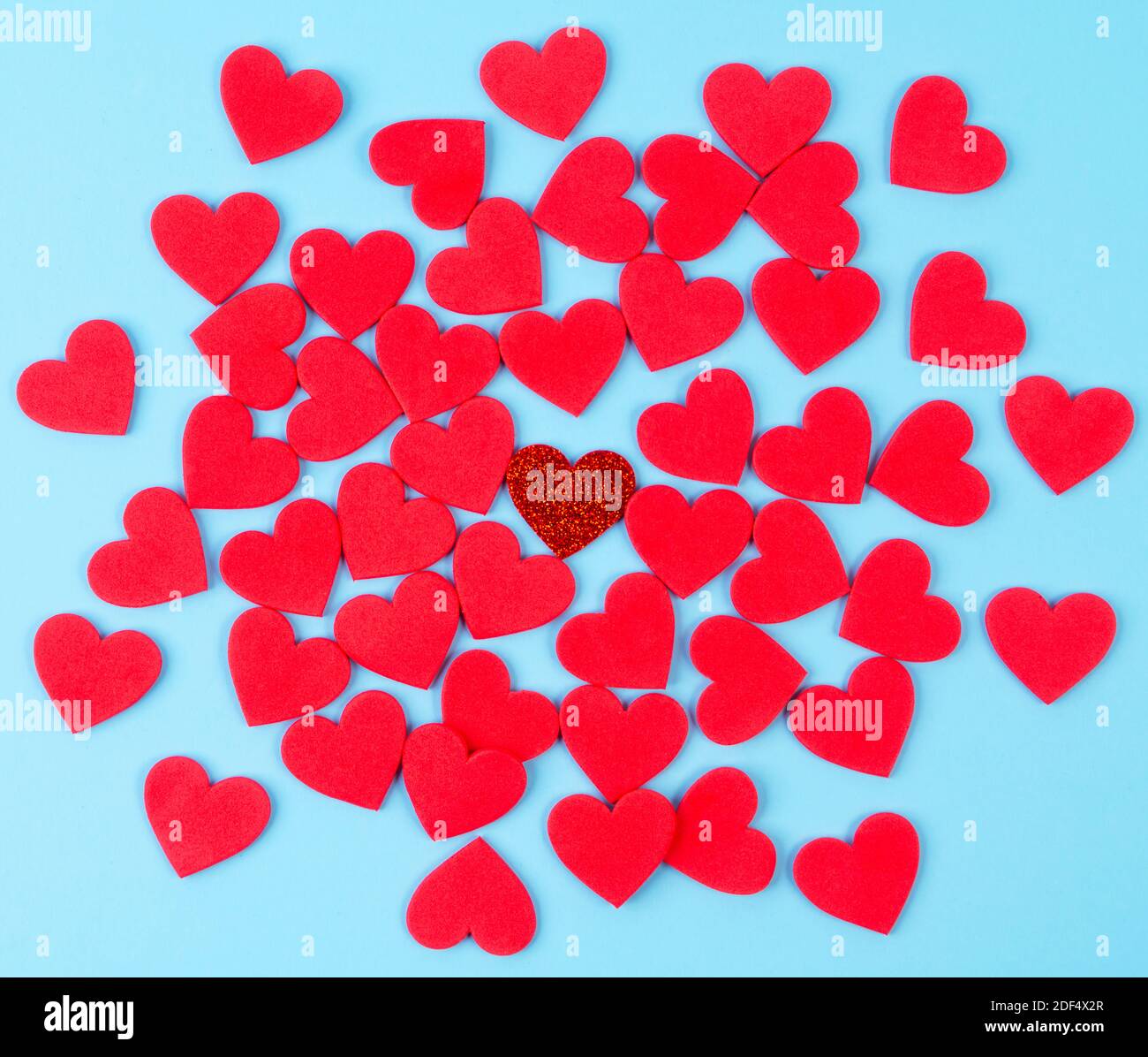 a texture formed with small red hearts on a blue background Stock Photo ...
