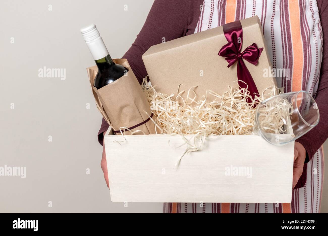 Worker of Delivery Service Packing Wine Bottle and Gifts to box with ...