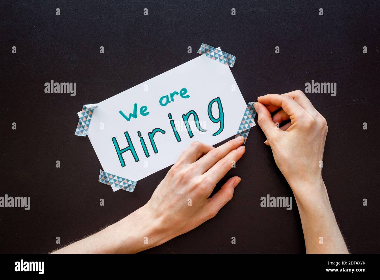 We are hiring - job recruting concept. Words We are hiring on paper ...