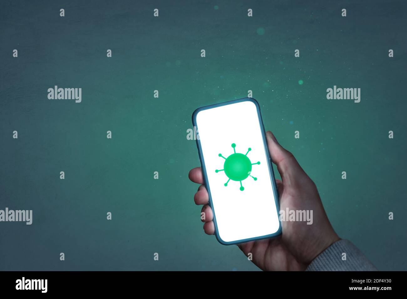 Smartphone screen with a virus symbol Stock Photo - Alamy
