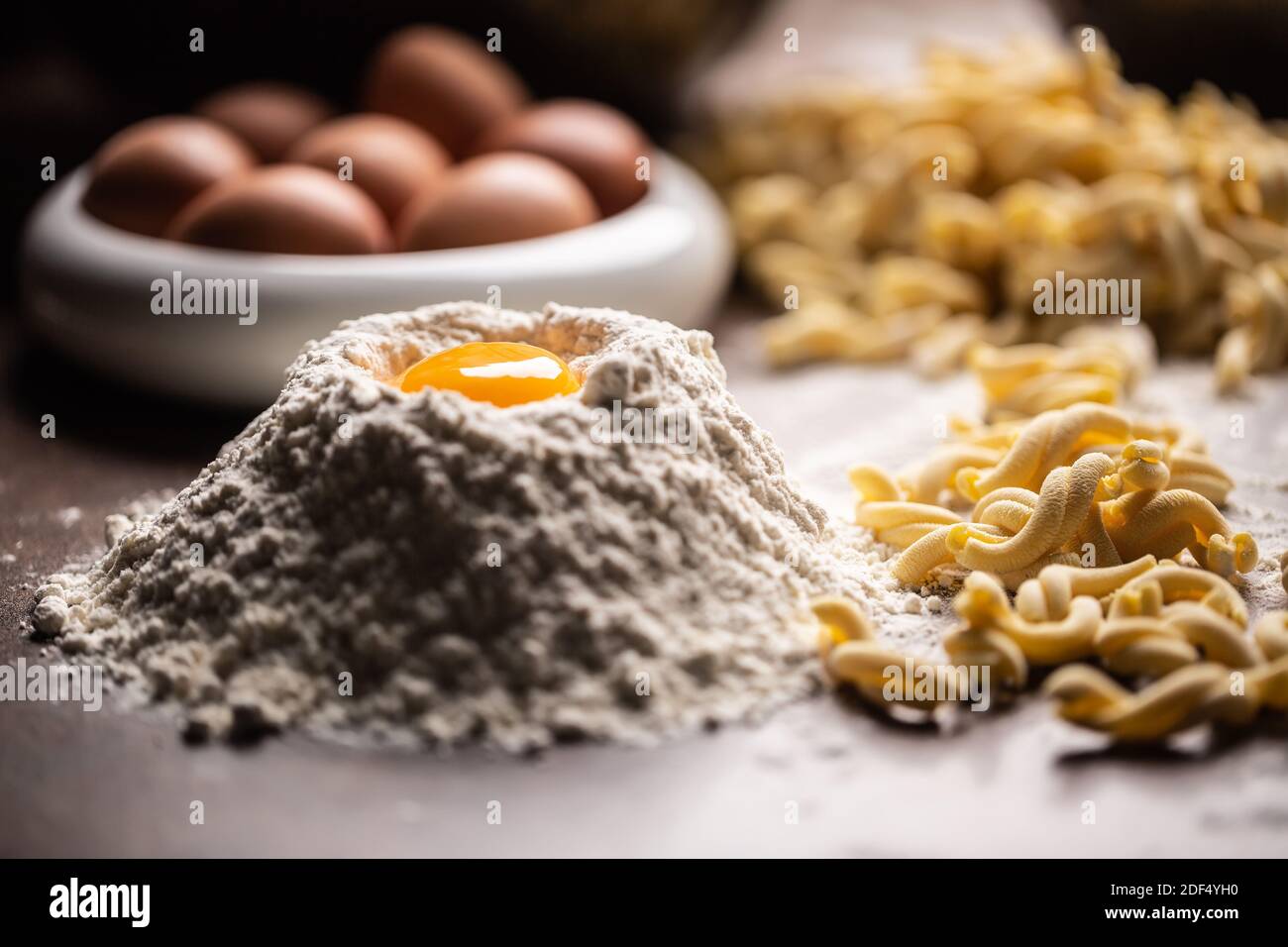 Fresh pasta recipe with flour, egg yolk and a twisted shaped pasta ...