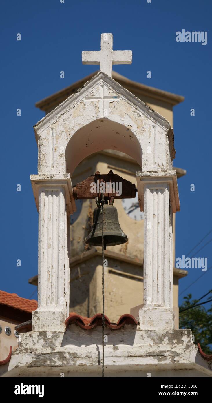 An old church bell tower with a cross on a blue sky background Stock ...