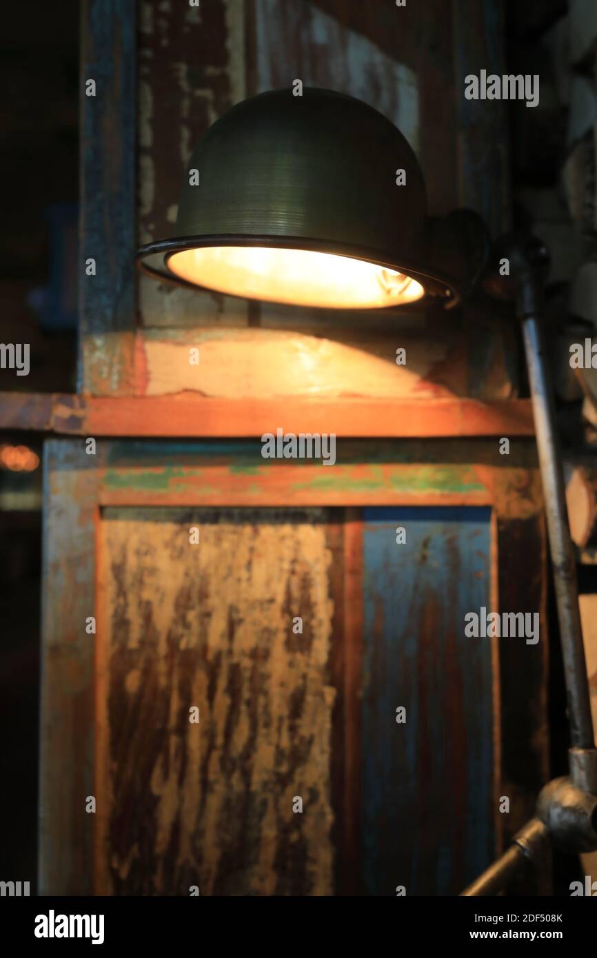 Lamp on background of vintage wooden wall Stock Photo - Alamy