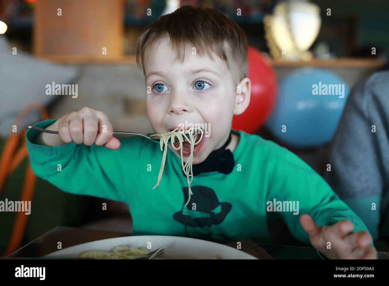 Child portrait eat spaghetti hungry hi-res stock photography and images ...