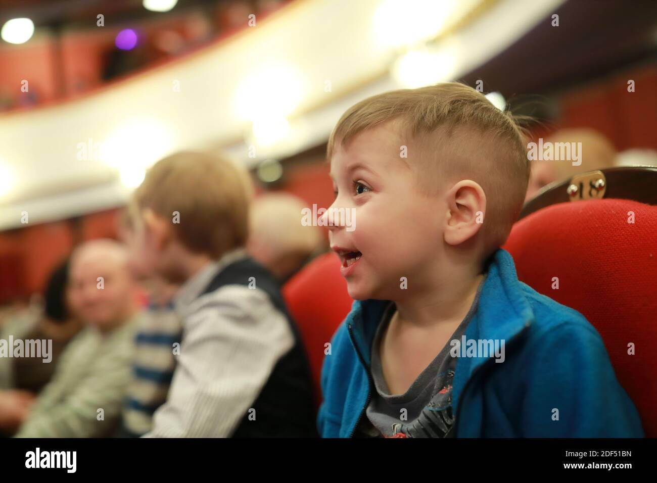 Portrait of smiling boy in the theater Stock Photo - Alamy