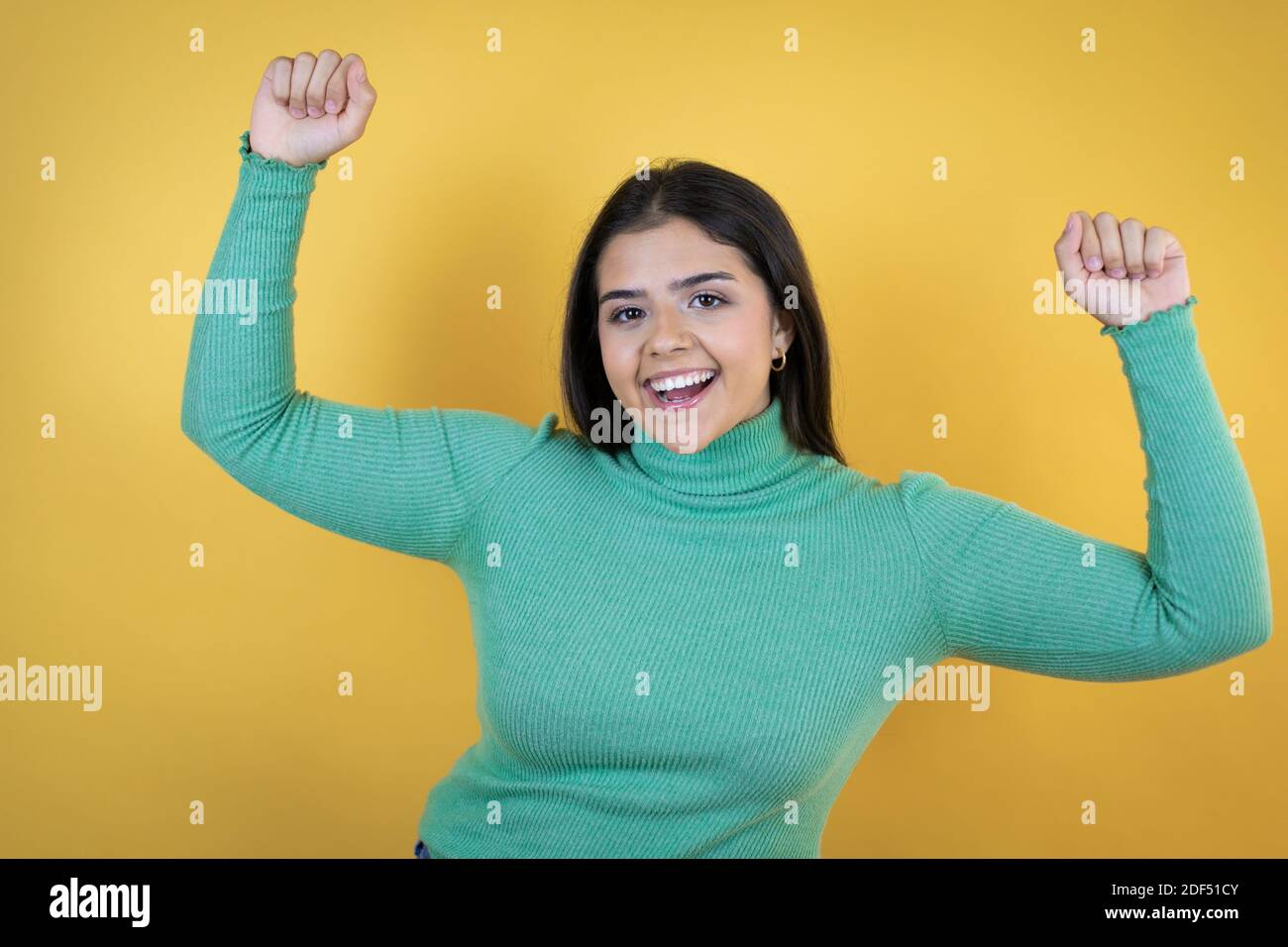 Young caucasian woman over isolated yellow background very happy and ...