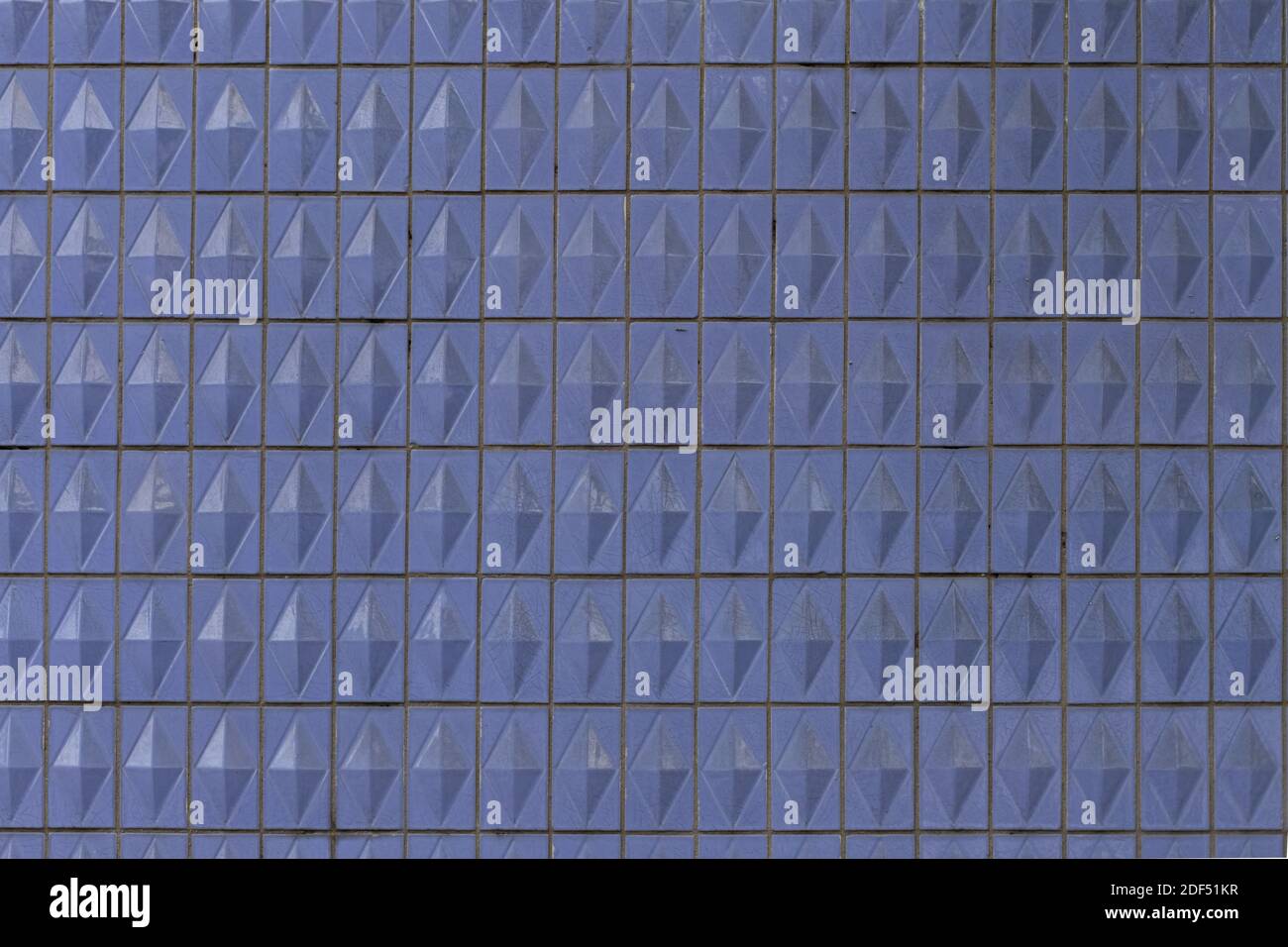 texture of violet blue tiles. on which there is a bulge in the form of ...