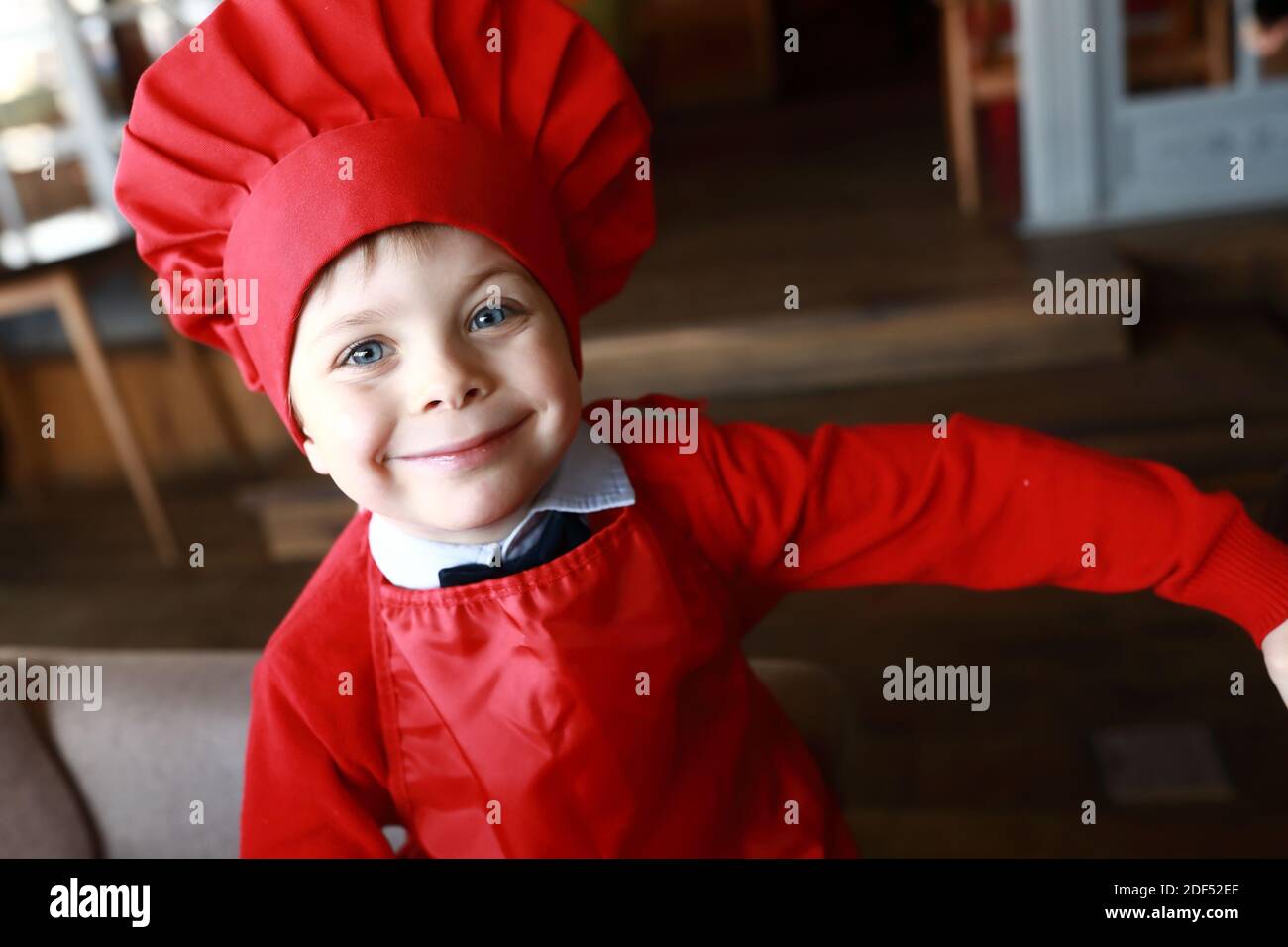 Portrait of happy child in cap cook Stock Photo - Alamy