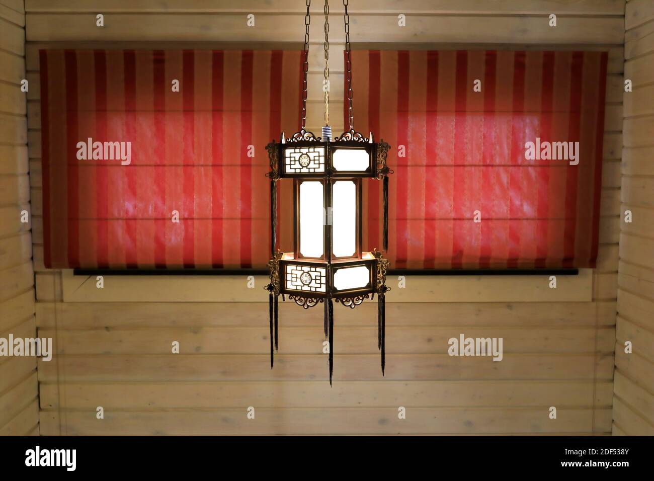 Chinese lamp on the background of wooden wall Stock Photo - Alamy