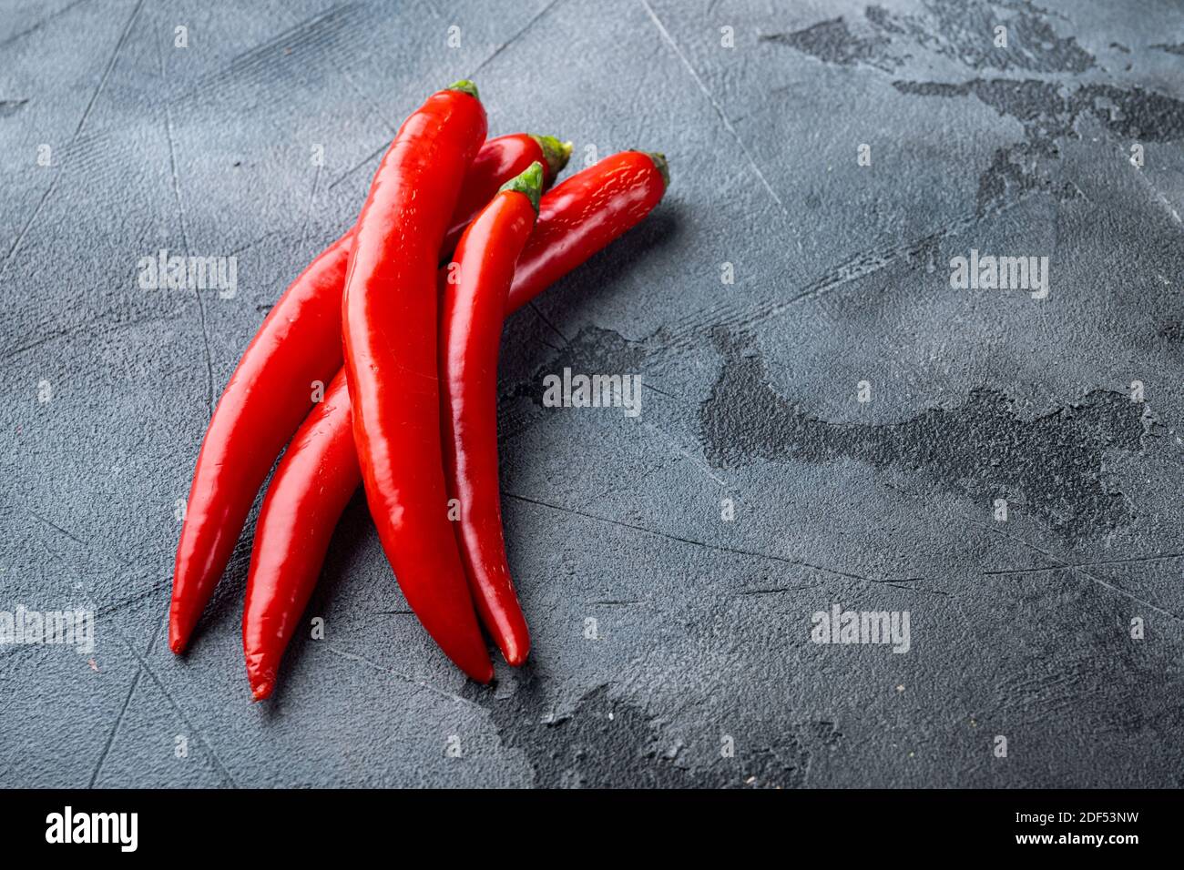 Raw red chili pepper set, on grey background with space for text Stock ...