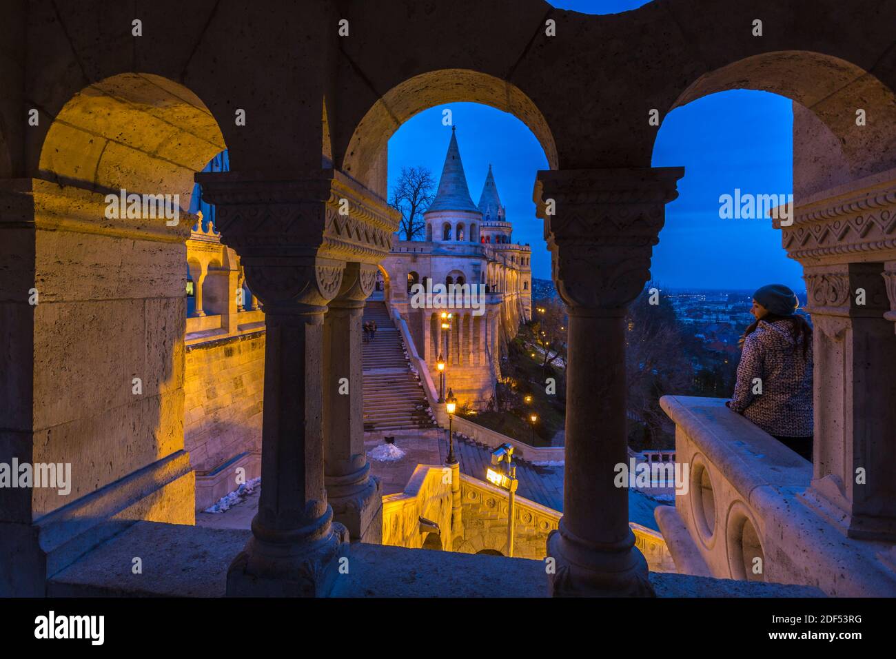 View of Fisherman's Bastion through sculptured arch windows at dusk ...