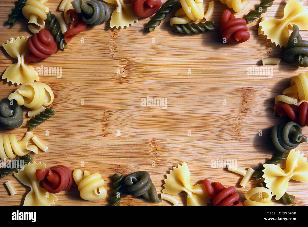 Colourful mixed dried pasta border Stock Photo - Alamy