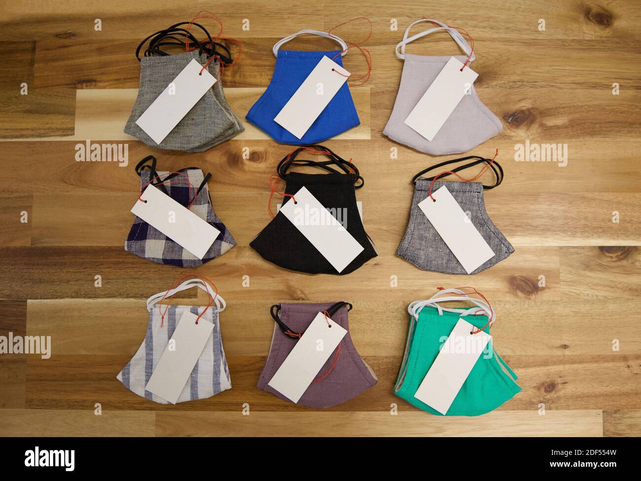 Handmade protective face masks with empty labels on the table Stock ...