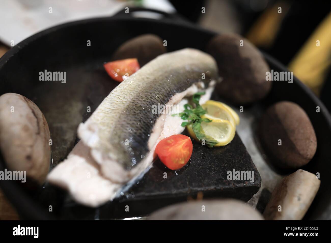 Cooked steamed whitefish in pan in restaurant Stock Photo - Alamy