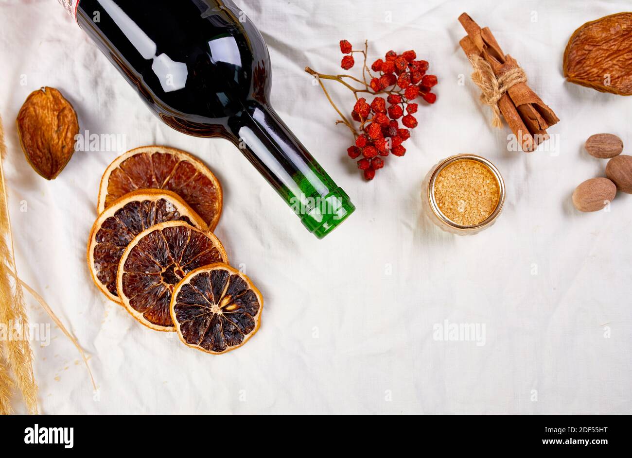 Flat lay of ingredients and bottle of red wine for winter seasonal ...