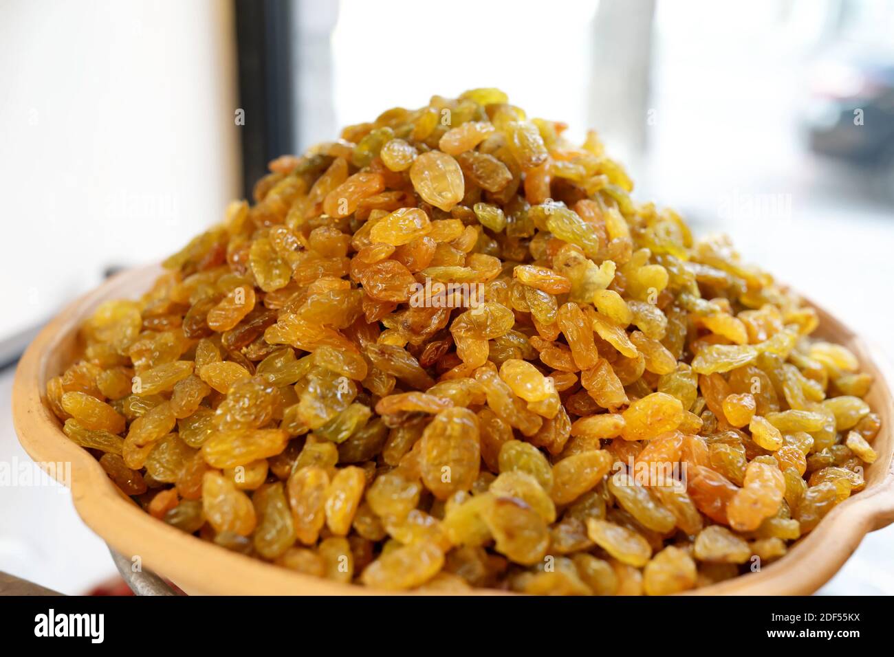 Raisins on a plate in the market Stock Photo - Alamy