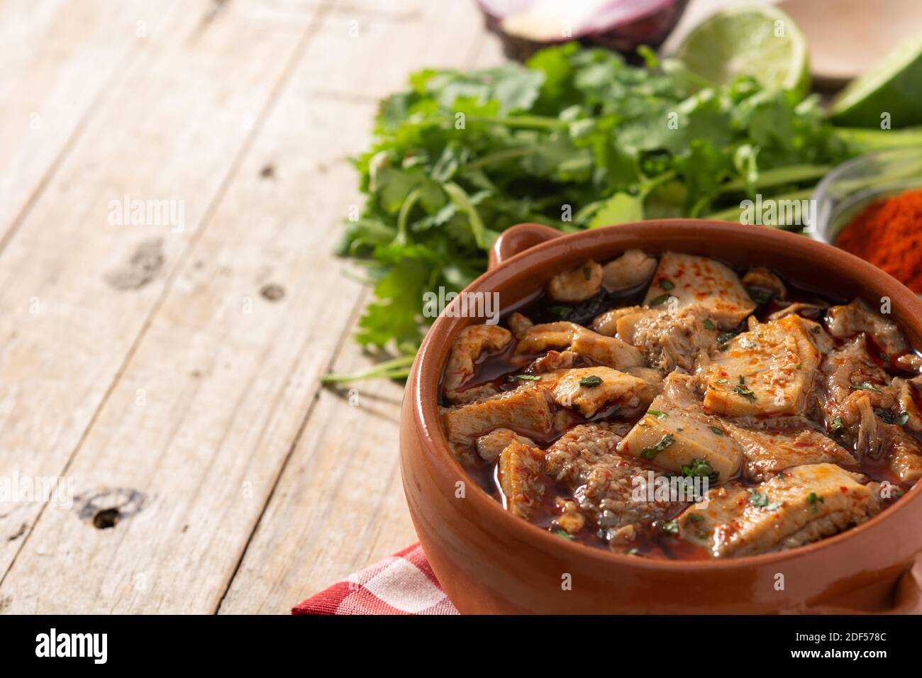 Traditional mondongo or el menudo soup on wooden table Stock Photo - Alamy
