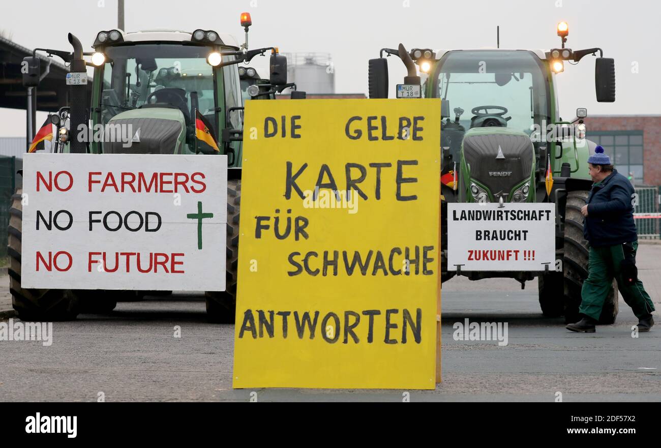 Waren, Germany. 03rd Dec, 2020. Dairy farmers block the access road to ...
