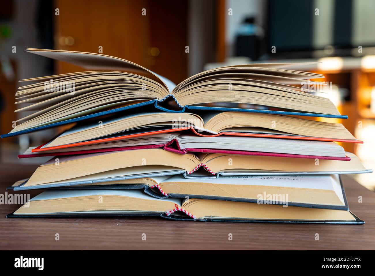 Books open, put on top of each other Stock Photo - Alamy