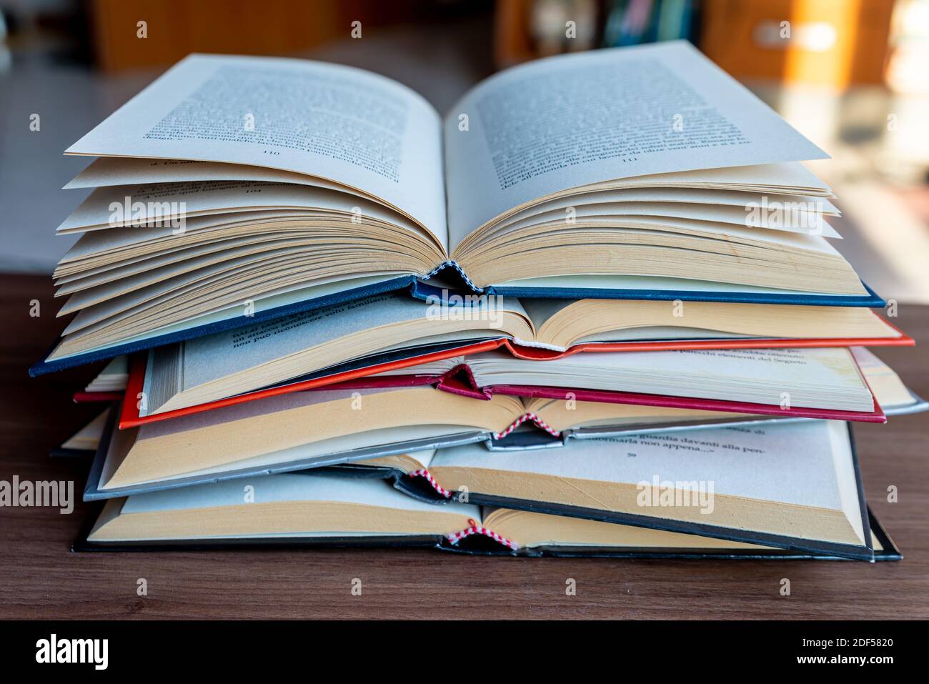 Books open, put on top of each other Stock Photo - Alamy