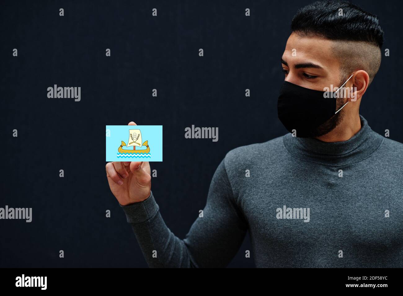 Egyptian man in gray turtleneck and black face protect mask show Kafr ...