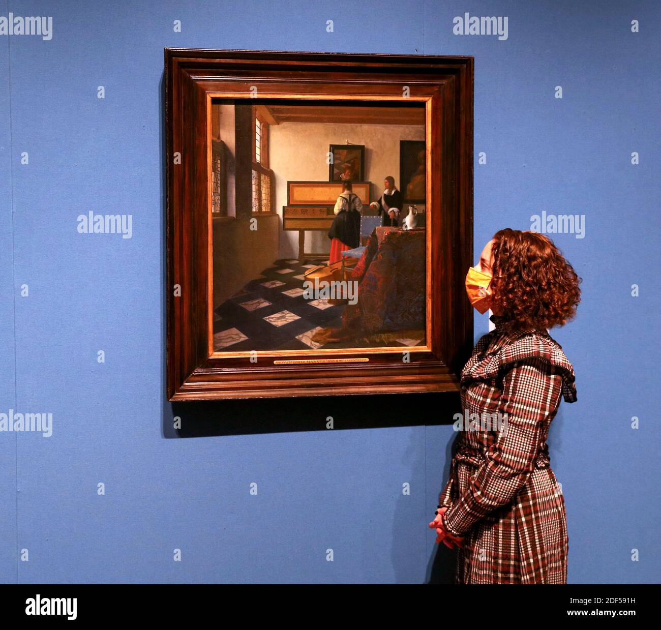 A woman looks at Lady at the Virginals with a Gentleman (ÔThe Music ...