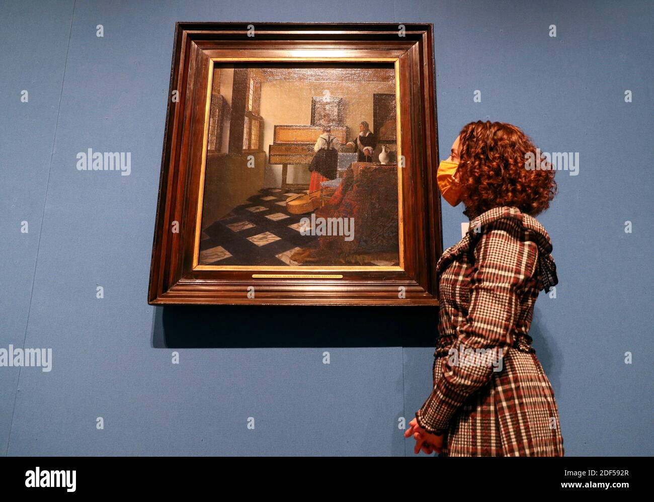 A woman looks at Lady at the Virginals with a Gentleman (ÔThe Music ...