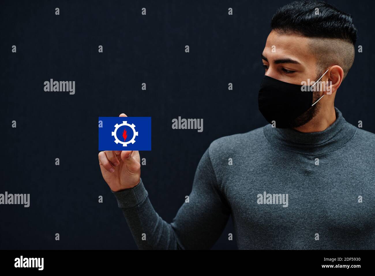 Egyptian man in gray turtleneck and black face protect mask show Suez ...