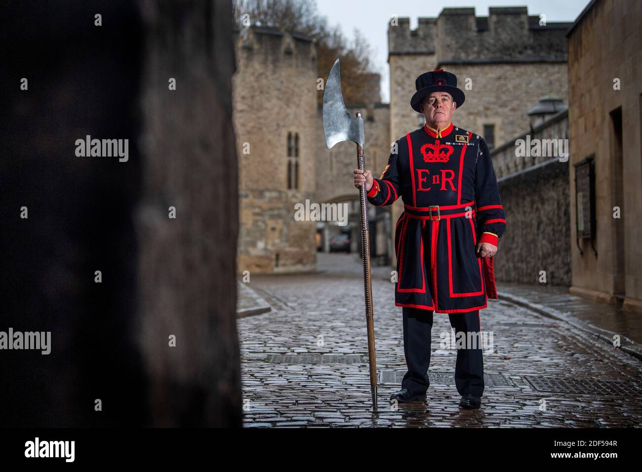 Incoming Yeoman Gaoler Rob Fuller holds the ceremonial Tower Axe, after ...