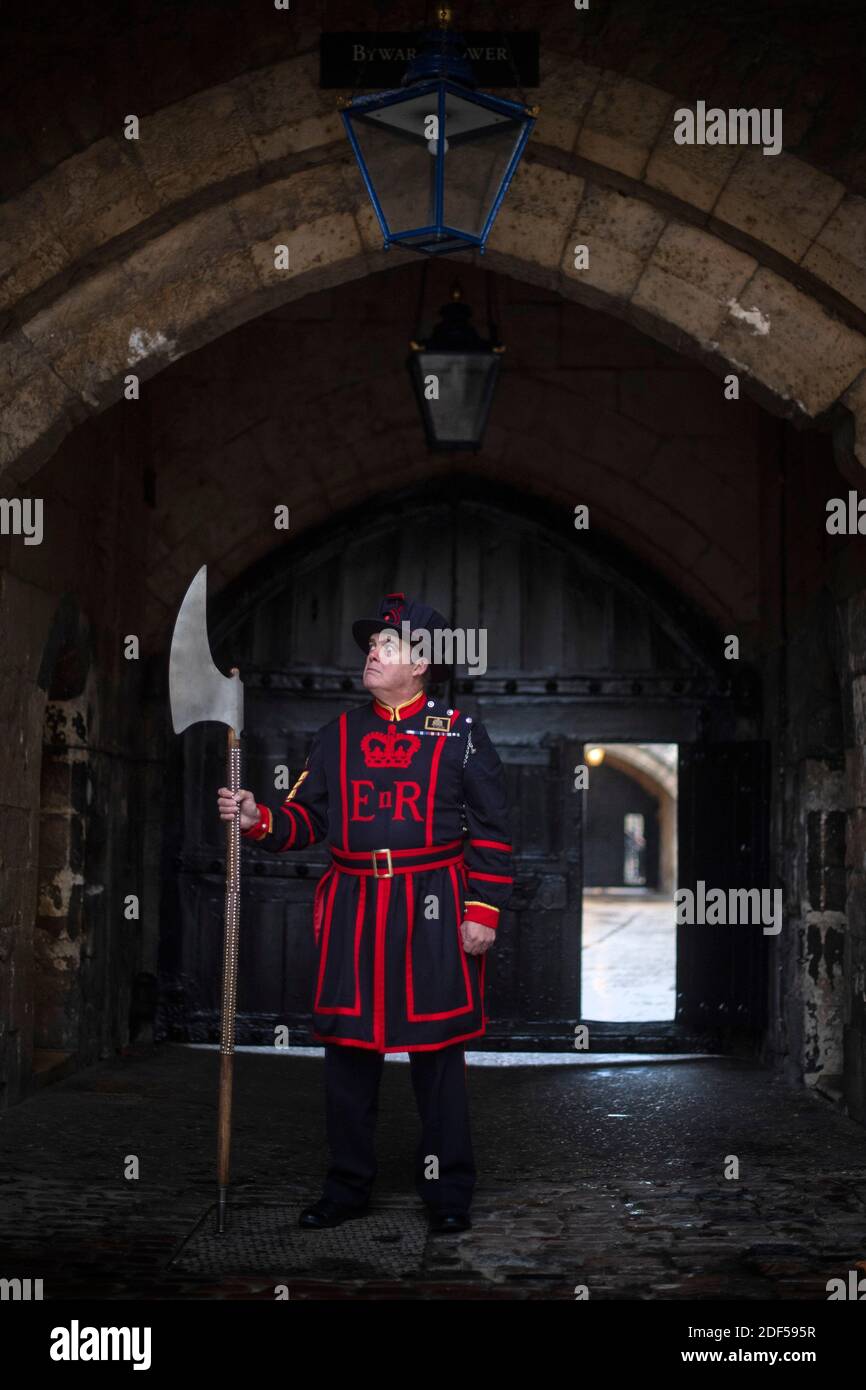 Incoming Yeoman Gaoler Rob Fuller holds the ceremonial Tower Axe, after ...