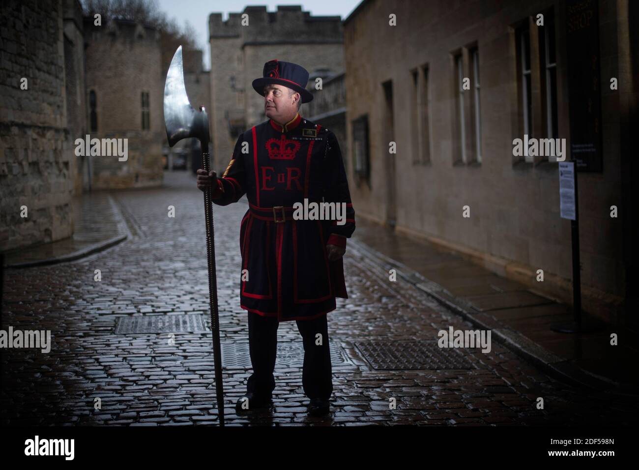 Incoming Yeoman Gaoler Rob Fuller holds the ceremonial Tower Axe, after ...