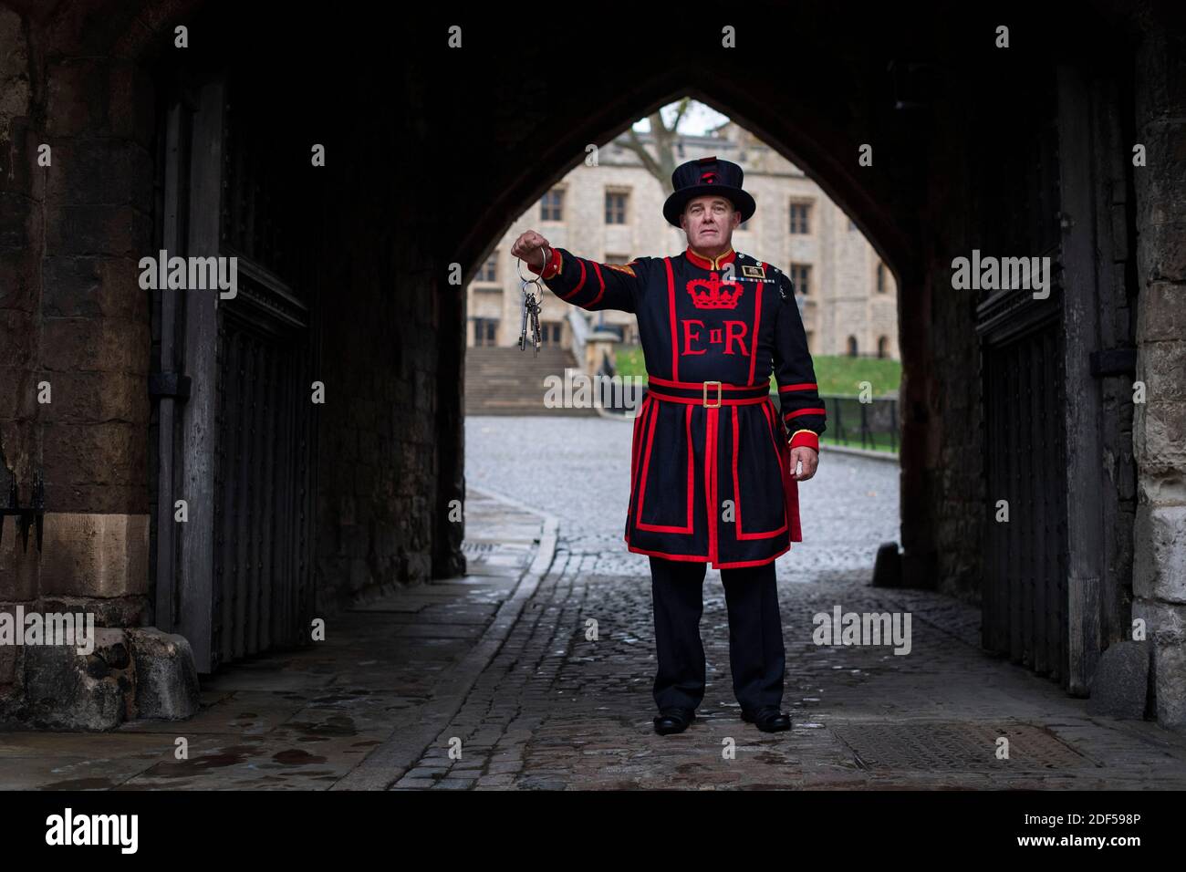 Incoming Yeoman Gaoler Rob Fuller holds the ceremonial keys after being ...