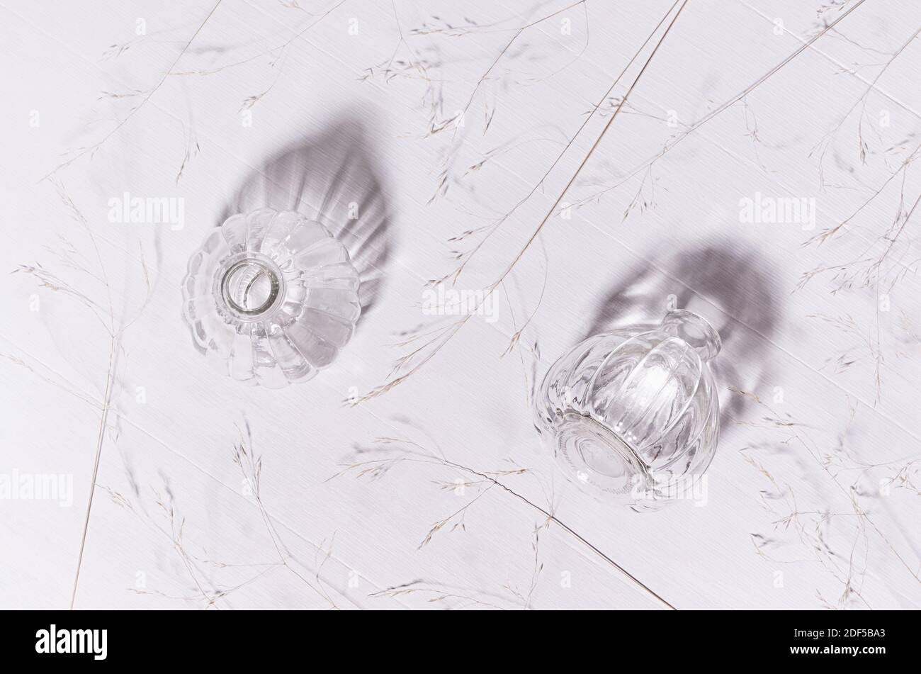 Simple autumn background - glass vials, panicles of dry fluffy beige ...