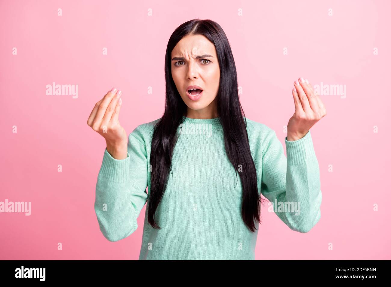 Photo portrait of confused woman showing two italian signs isolated on ...