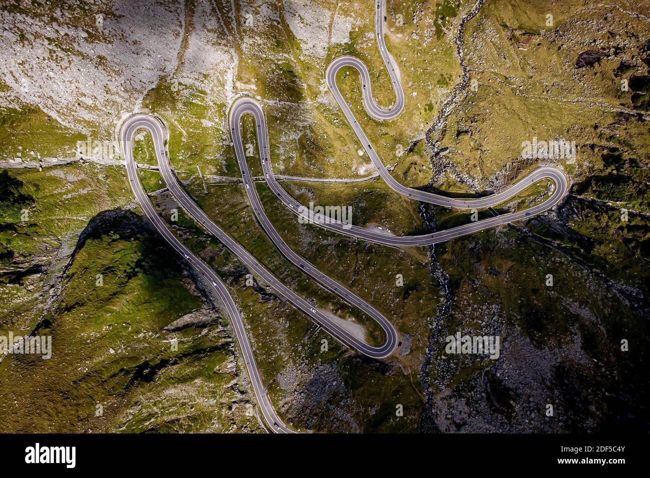 Winding road in the mountains, aerial view Stock Photo - Alamy