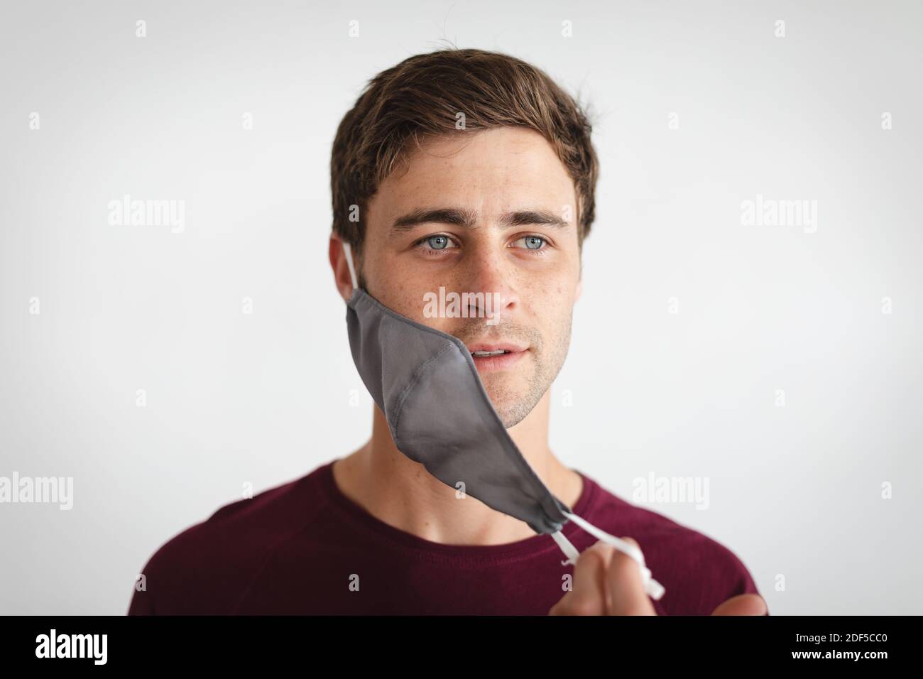 Removing the mask hi-res stock photography and images - Alamy