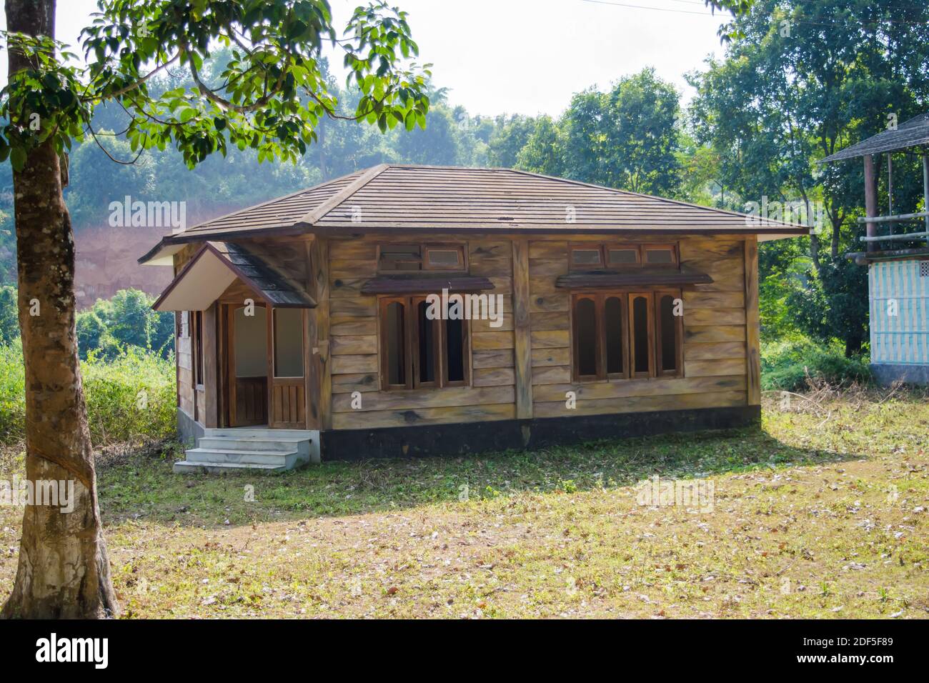 Traditional type of house in Northeast India, nice green trees Stock ...