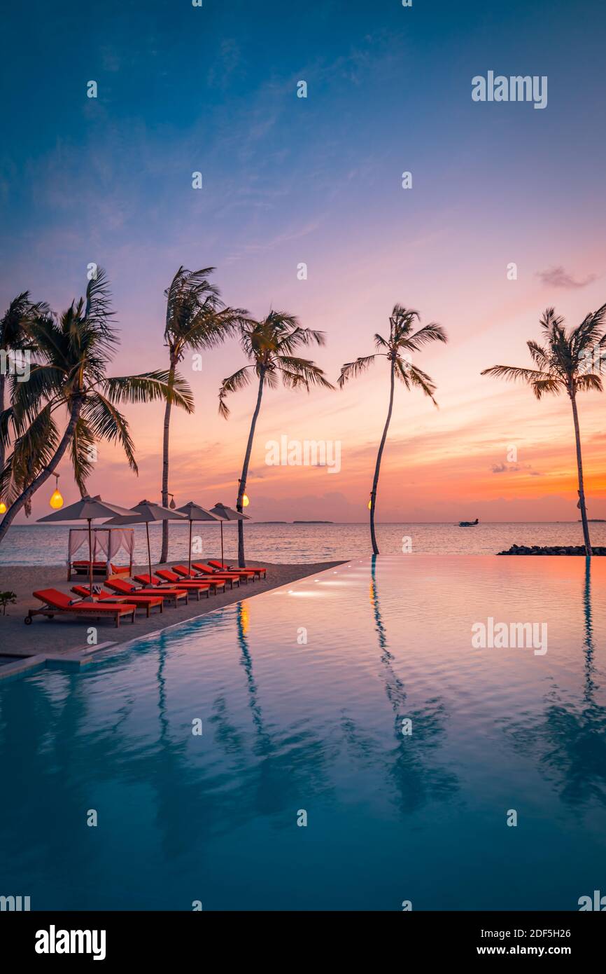 Beautiful poolside and sunset sky. Luxurious tropical beach landscape ...