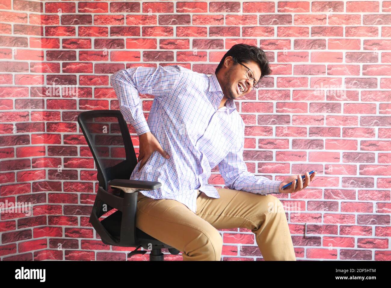 young man suffering back pain close up Stock Photo - Alamy