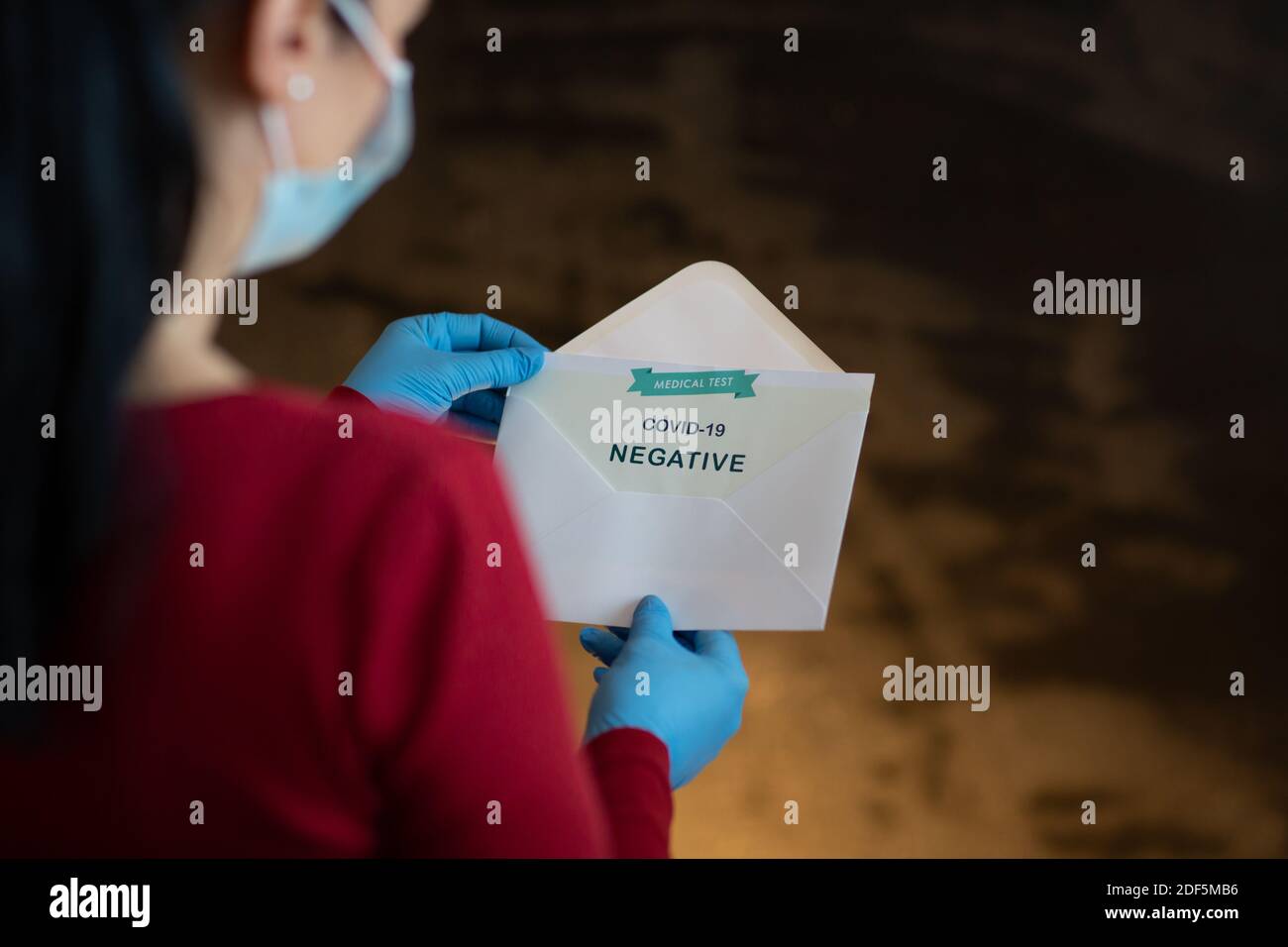 Woman Holding Negative Antigen Detection Test for Covid-19. Back View ...