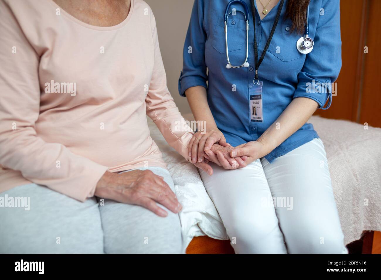Close up of Home Caregiver Holding Hands of Elderly Woman Patient ...