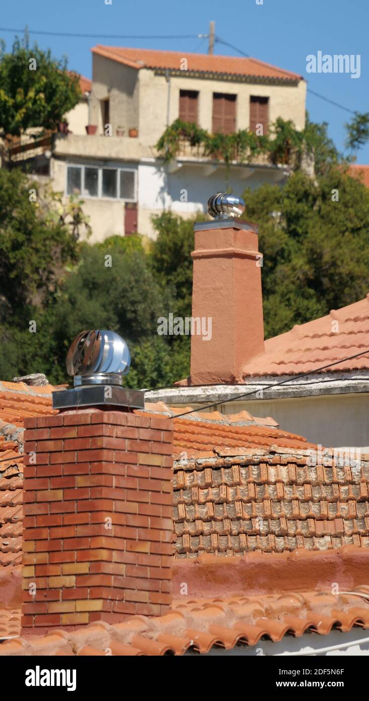 A vertical closeup of a brick chimney on a house background Stock Photo ...