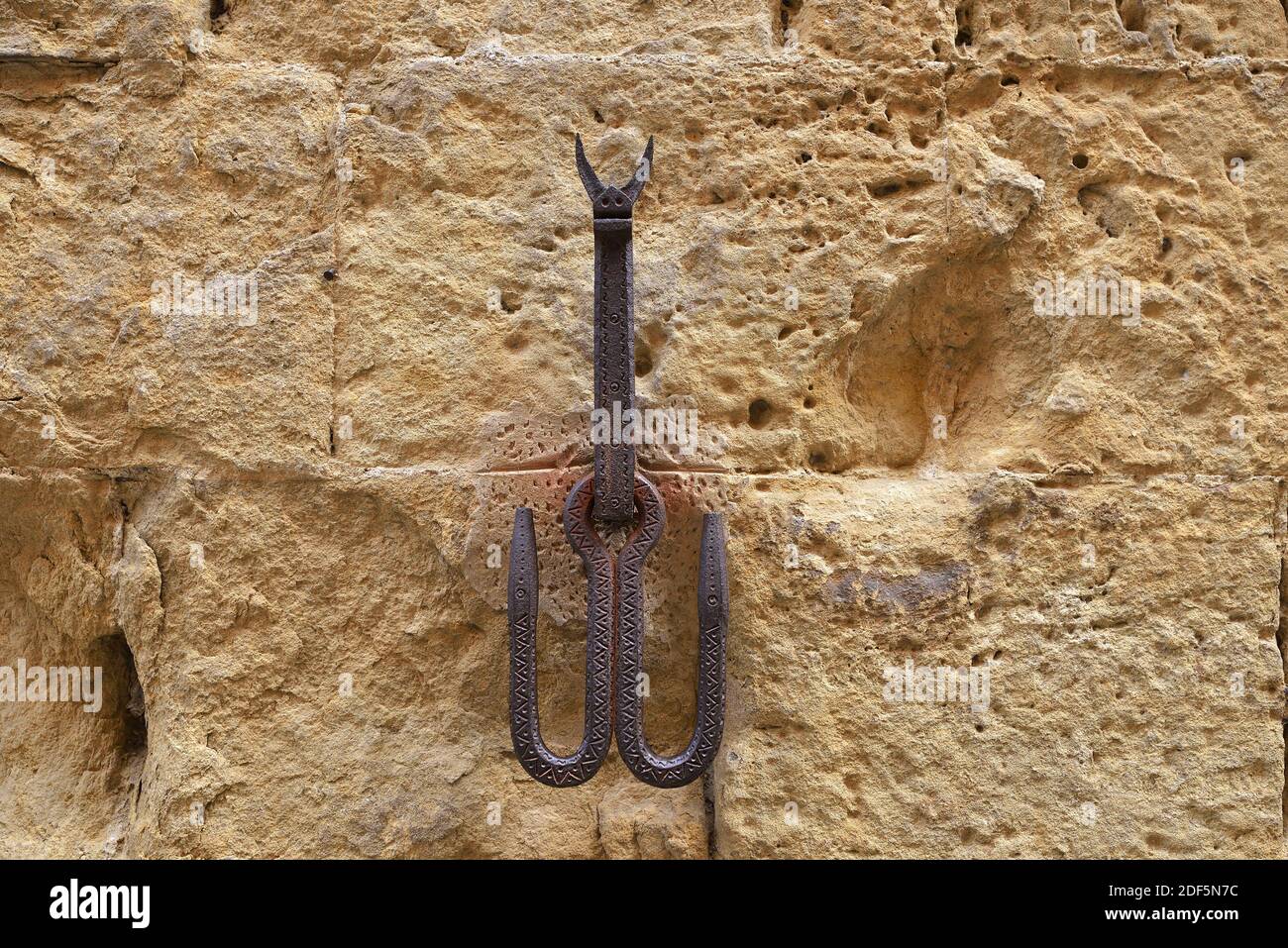 Ancient wrought iron hooks for tying with rope the animals, horses ...