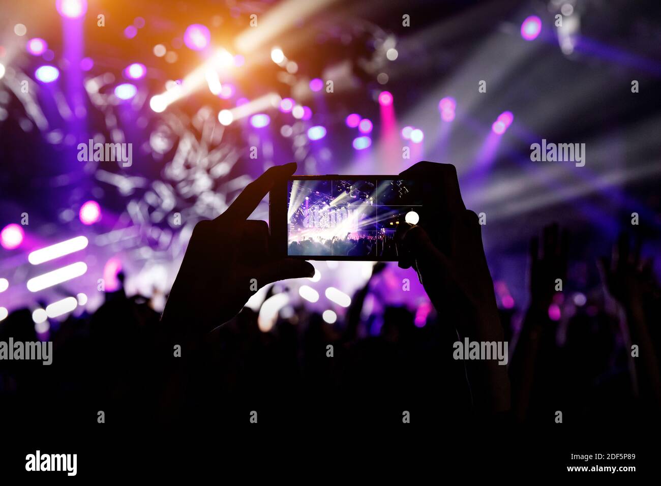 Shooting on mobile phone. Concert on stage Stock Photo - Alamy