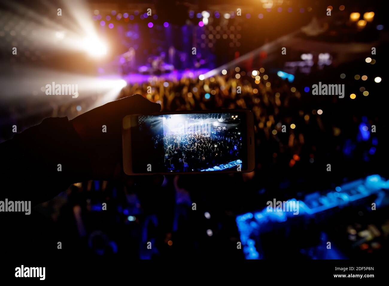 Shooting on mobile phone. Concert on stage Stock Photo - Alamy