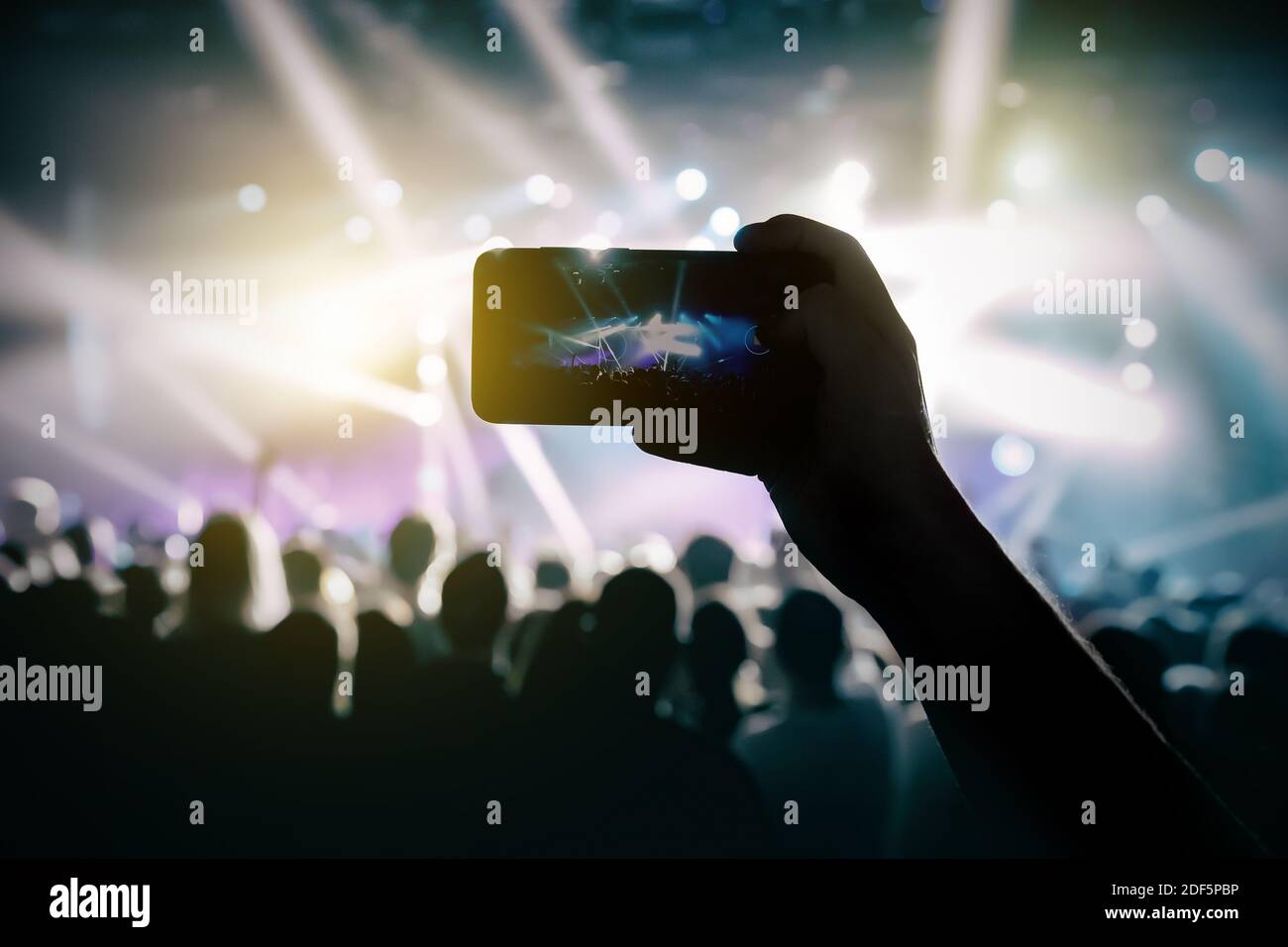 Instagram photo to mobile phone. Concert light performance Stock Photo ...
