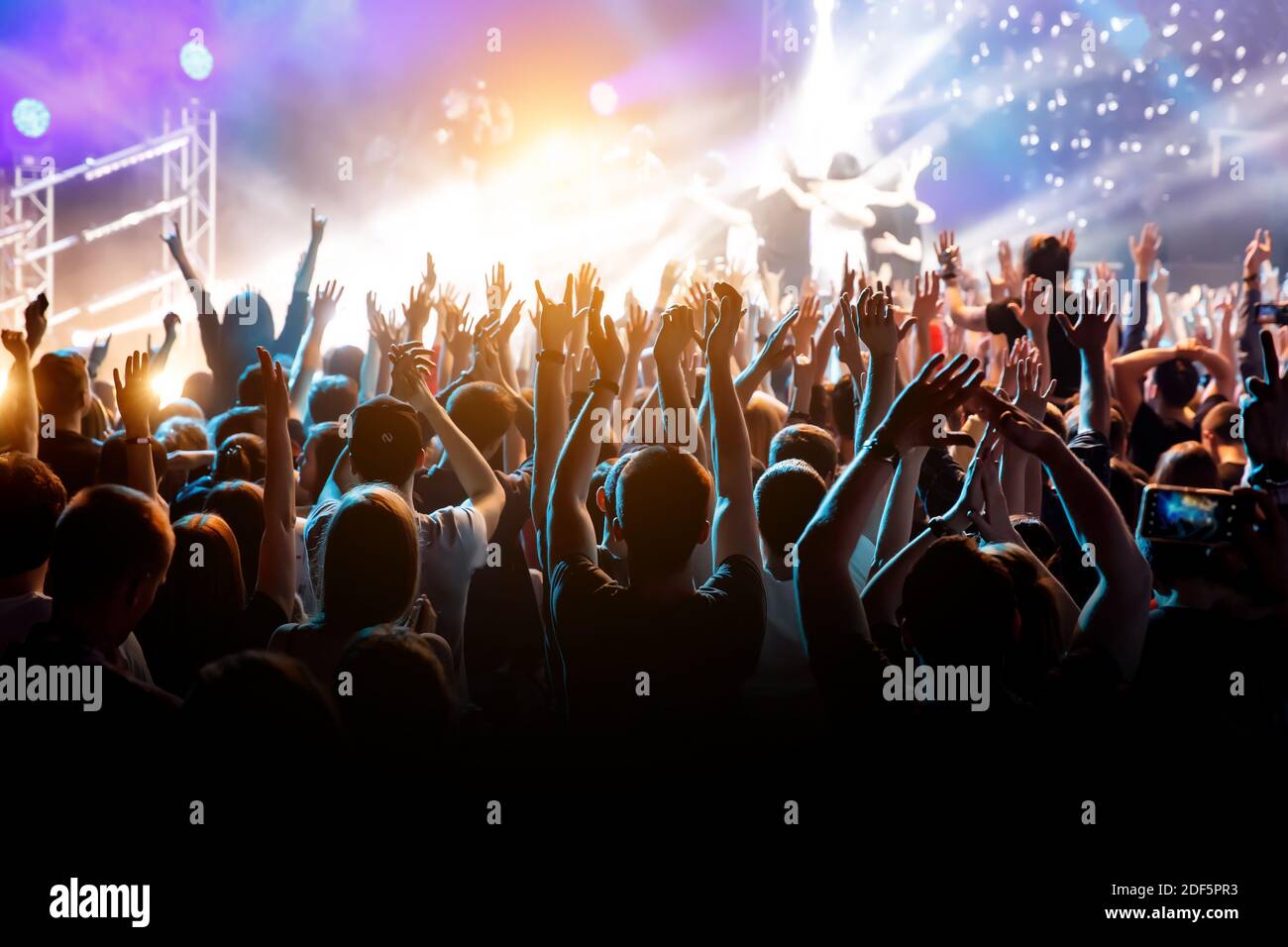 Crowd with raised hands on music concert Stock Photo - Alamy